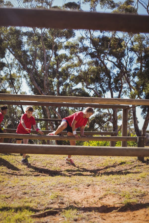 Kids Jumping Over the Hurdles during Obstacle Course Training Stock ...