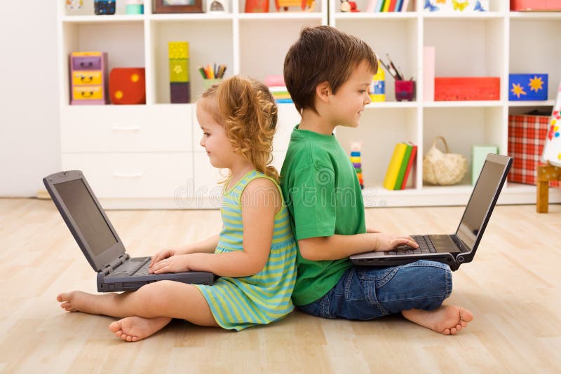 Kids Playing on Laptop Computer at Home Stock Photo - Image of modern ...