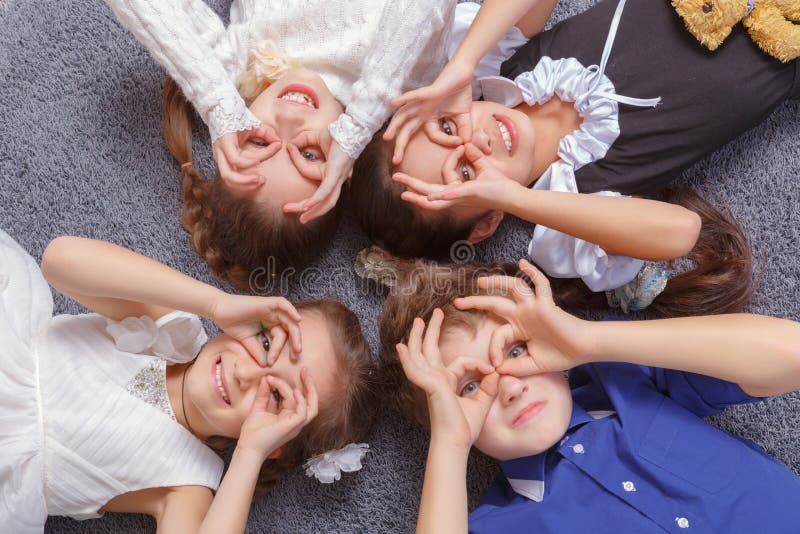 Kids lay on the floor stock photo. Image of creativity - 52366580