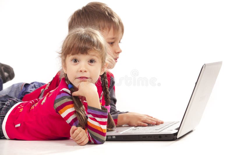Kids laying with notebook stock photo. Image of brother - 17515846