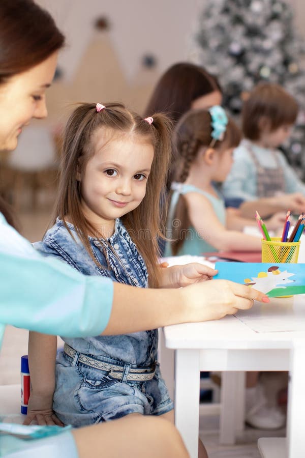 Kids Learning Arts and Crafts in Kindergarten with Teacher Stock Image ...