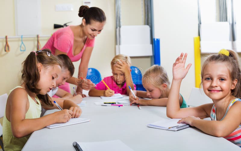 Kids Learning To Write on Lesson in Elementary School Class Stock Photo ...