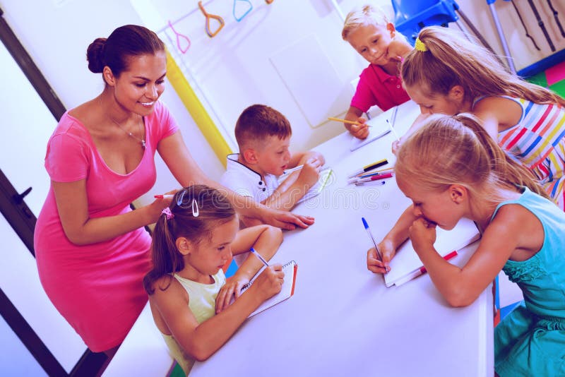 Kids Learning To Write on Lesson in Elementary School Class Stock Image ...