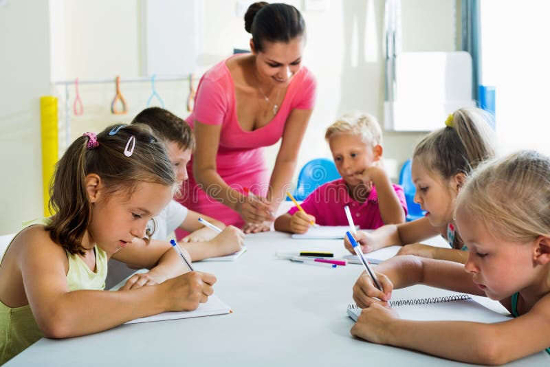 Kids Learning To Write on Lesson in Elementary School Class Stock Photo ...