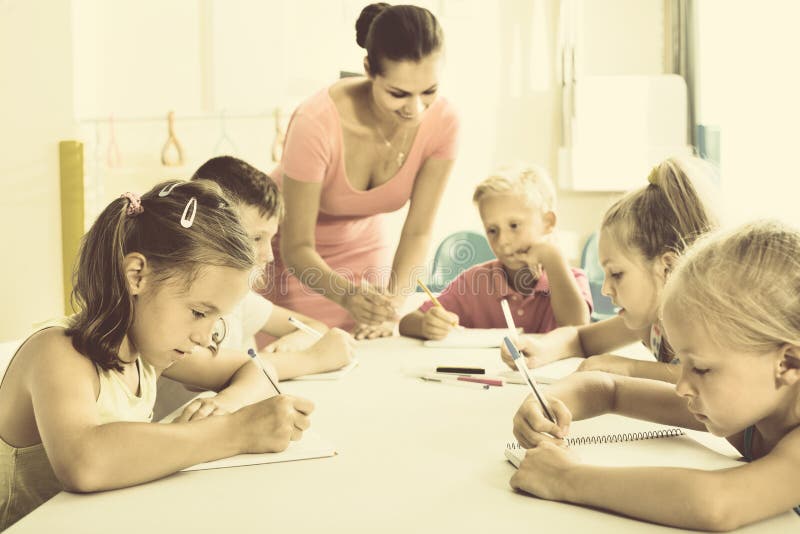 Kids Learning To Write on Lesson in Elementary School Class Stock Photo ...