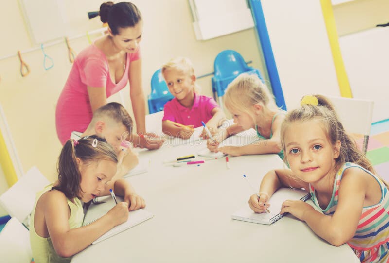 Kids Learning To Write on Lesson in Elementary School Class Stock Photo ...