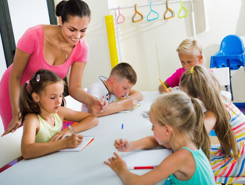 Kids Learning To Write on Lesson in Elementary School Class Stock Photo ...