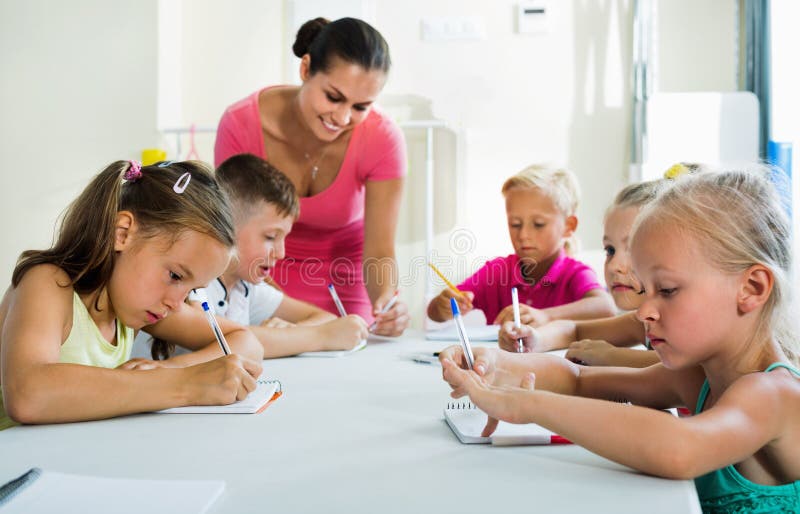 Kids Learning To Write on Lesson in Elementary School Class Stock Image ...