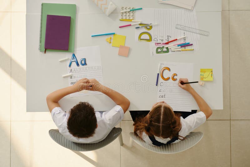 Kids Learning Writing Letters Stock Image - Image of classmates, school ...