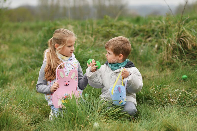 The Kids Looking for Eggs in a Bag for Easter Stock Photo - Image of ...