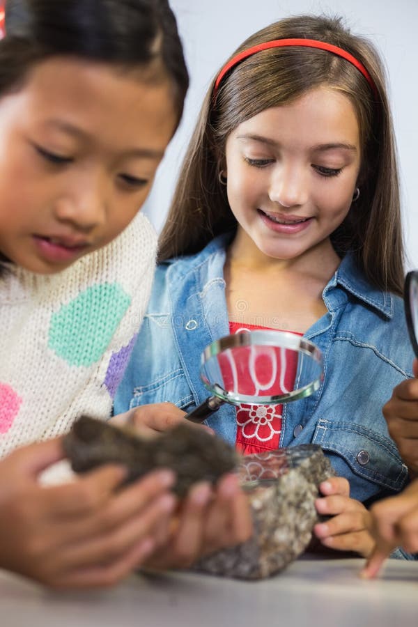 Kids Looking at Specimen Stone through Magnifying Glass Stock Image ...