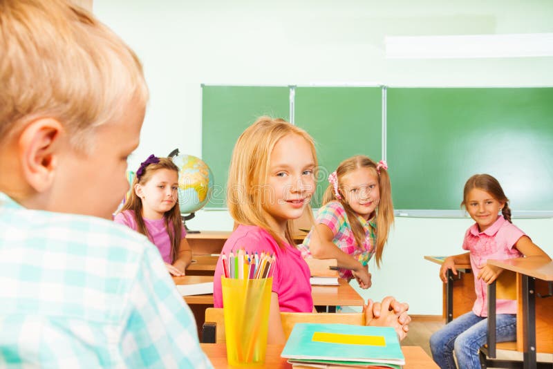 Kids Looking Straight while Sitting at Tables Rows Stock Image - Image ...