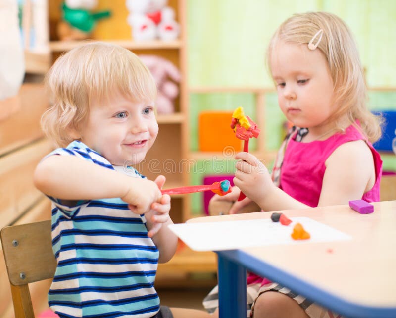 Kids Making Arts and Crafts in Kindergarten with Interest Stock Image ...