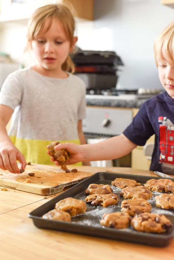 Kids Making Cookies in Kitchen Placing Dough on Tray for Cooking at ...