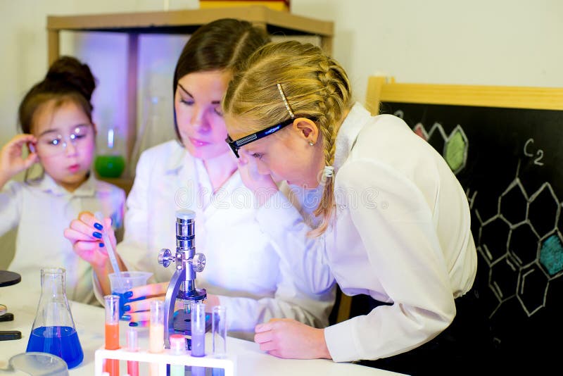 Kids Making Science Experiments Stock Image - Image of microscope, girl ...