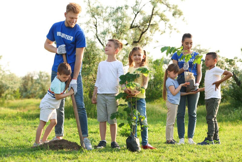 Kids Planting Trees with Volunteers Stock Image - Image of environment ...