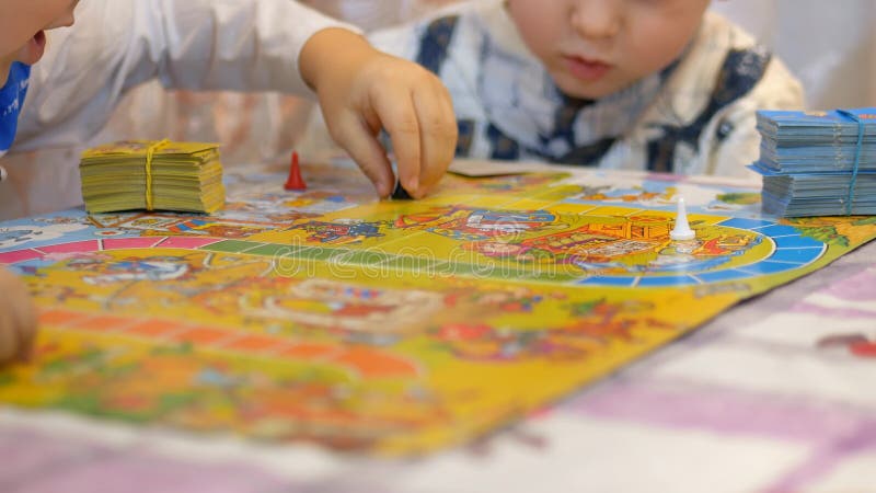 The Kids Play Board Games at the Table with Family Stock Video - Video ...
