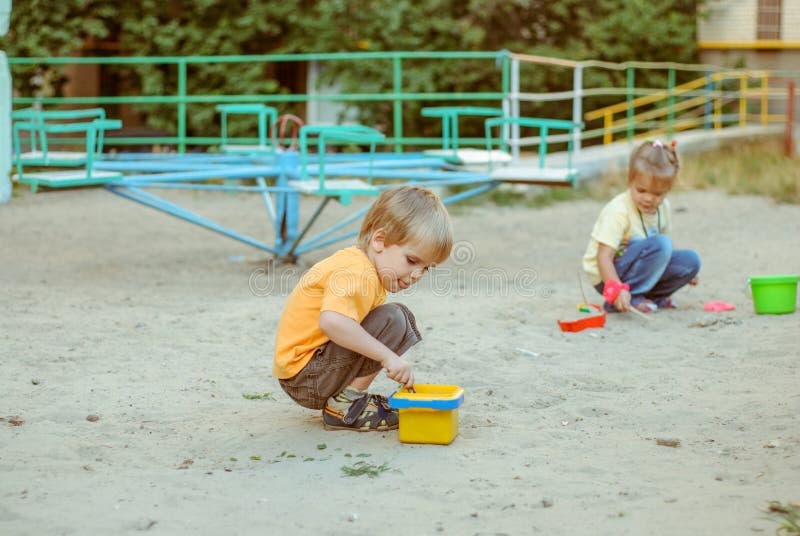 Kids play in the sand box stock photo. Image of childhood - 31210732