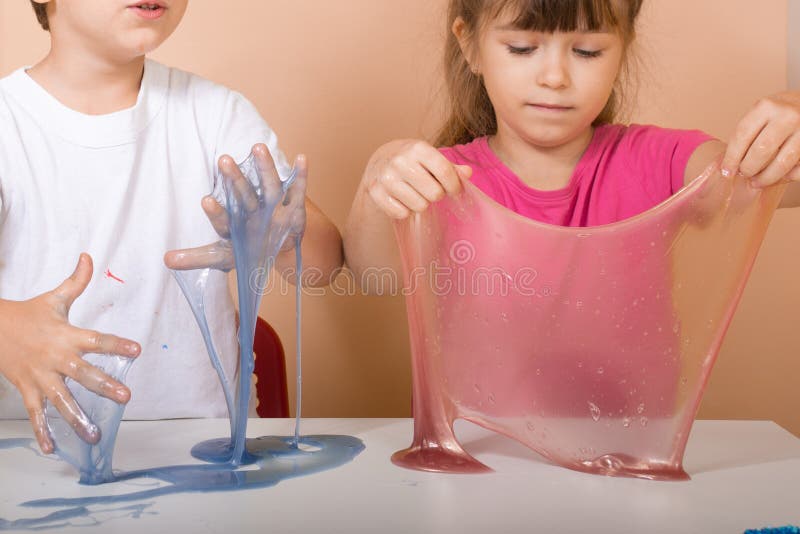 Wow Big Slime! Children Play with Yellow Slime. Stock Photo - Image of ...