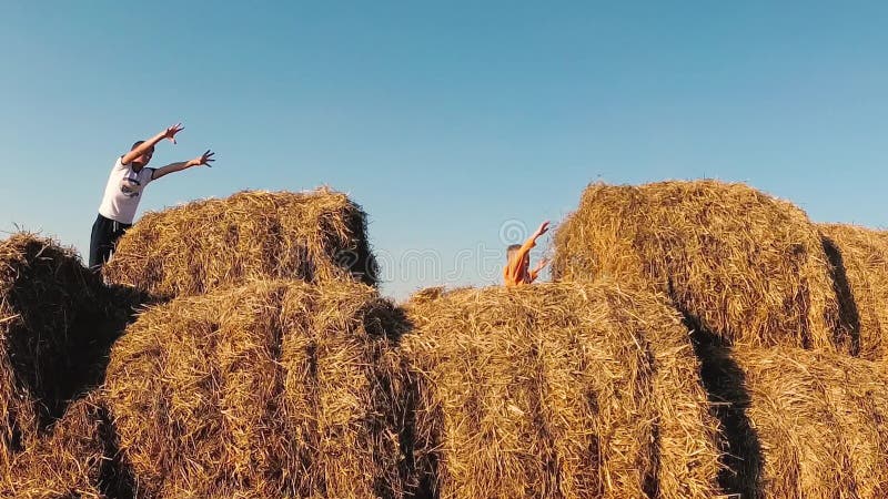 Kids Play in a Stack of Straw. Stock Video - Video of farm, healthy ...