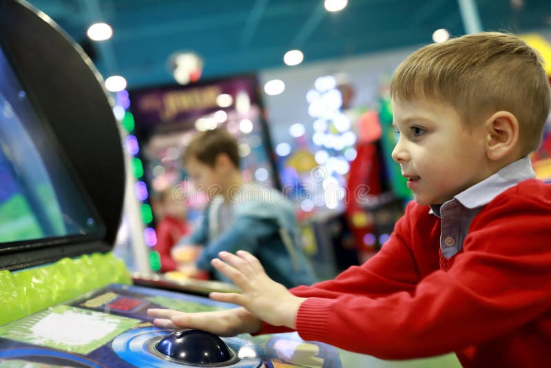 170 Boy Playing Arcade Game Machine Stock Photos - Free & Royalty-Free ...