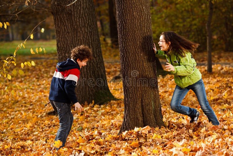 Kids Playing in Autumn Park Stock Photo - Image of child, active: 23097386