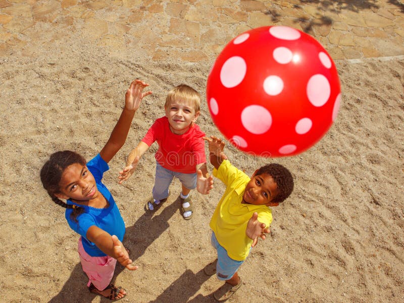 Kids playing with a ball stock image. Image of group - 73188545
