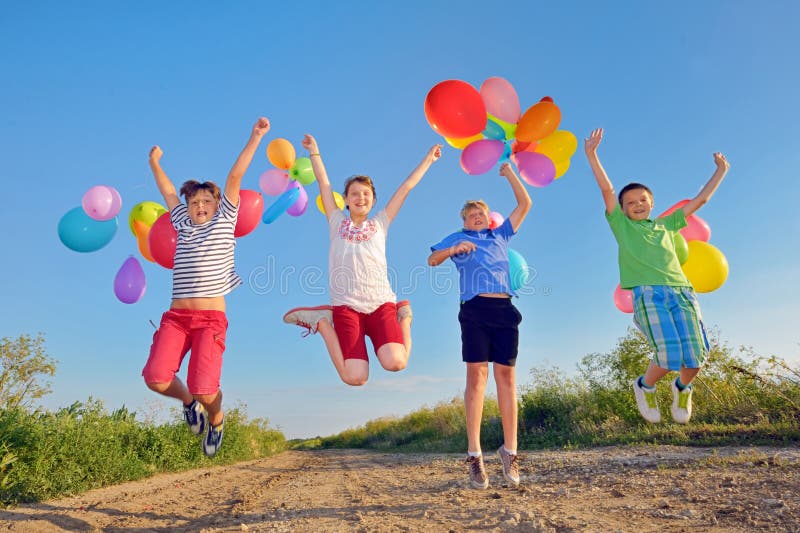 Kids playing with balloons stock photo. Image of elementary - 32005582