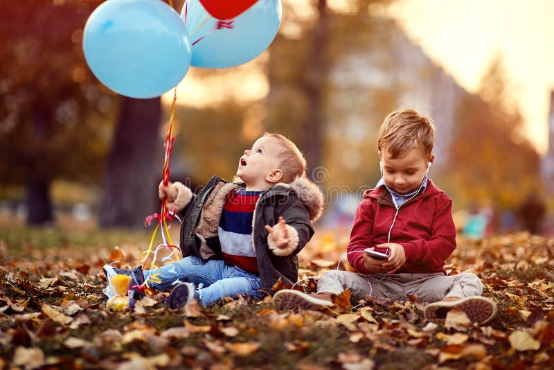 Kids Playing with Balloons and Smartphone Outdoors Stock Photo - Image ...