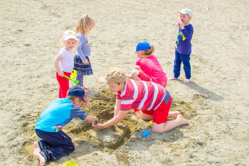Kids playing at the beach stock image. Image of holiday - 39171055