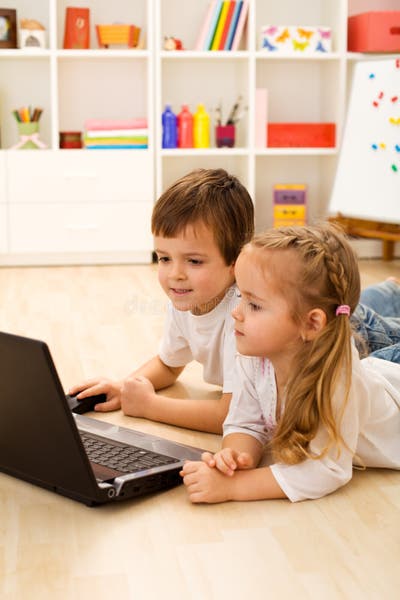 Kids Playing Computer Game on Laptop Stock Photo - Image of family ...
