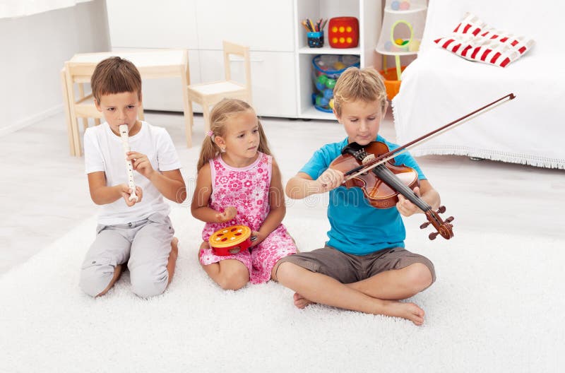Kids Playing on Different Musical Instruments Stock Photo - Image of ...