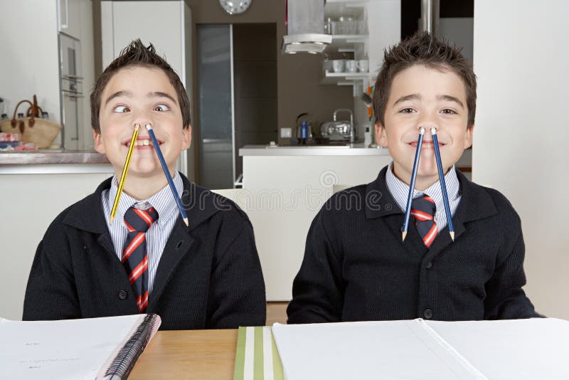 Kids Playing while Doing Homework at Home Stock Photo - Image of blue ...