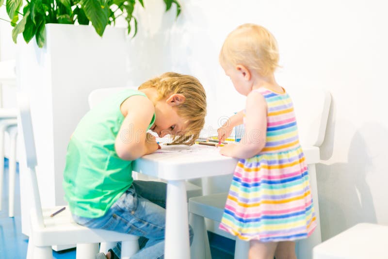 Kids Playing and Drawing in Kids Table, Activity Corner Stock Image ...