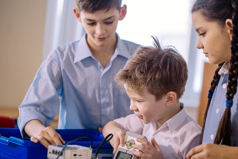 Kids Playing with Electrical Robot while Visiting Robotics Exhibition ...