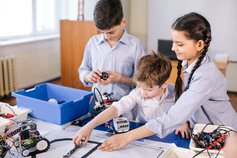 Kids Playing with Electrical Robot while Visiting Robotics Exhibition ...