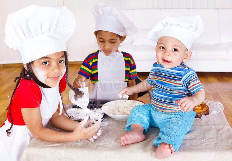 Kids playing with flour stock image. Image of apron, cheerful - 19255515