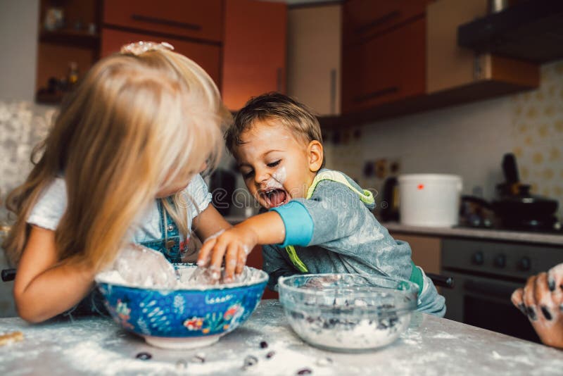 Kids is playing with flour stock image. Image of life - 60301787