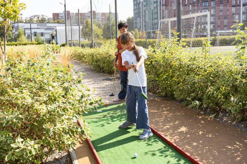 Kids Playing Golf Inside Playground Artificial Grass Activity Game for ...