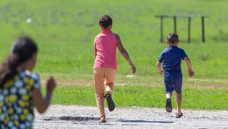 Kids Playing on the Grass in the Park Editorial Stock Photo - Image of ...