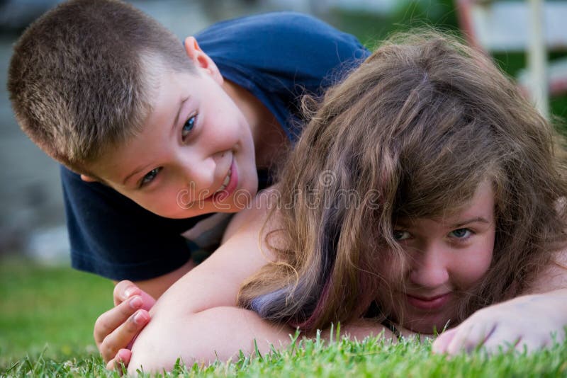 Kids playing in the grass stock image. Image of grass - 69747477