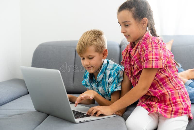 Kids Playing with Laptop Computer at Home Stock Photo - Image of ...