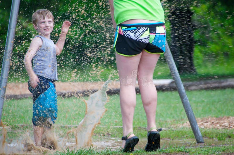 Kids Playing in Mud stock image. Image of kick, mess - 13081309