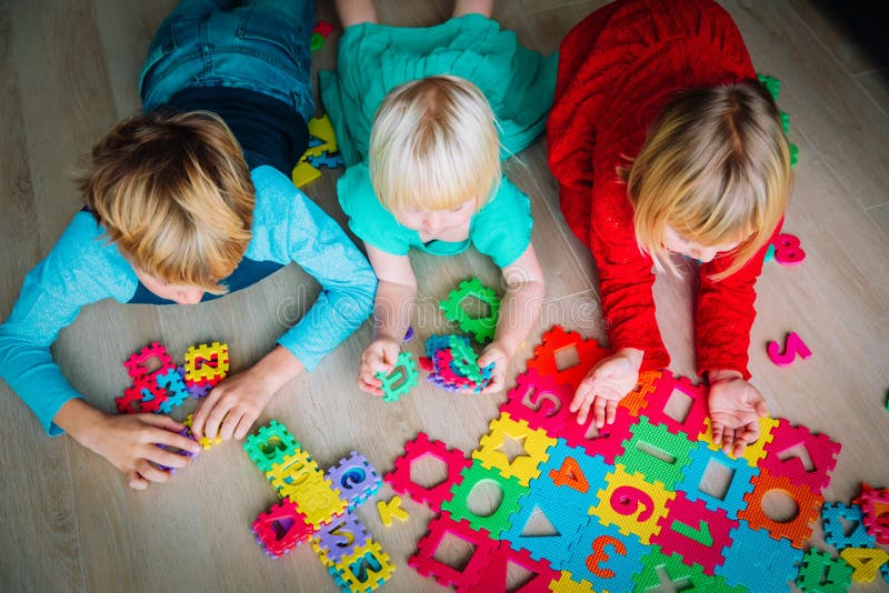 Kids Playing with Number and Shapes Puzzle Stock Photo - Image of ...
