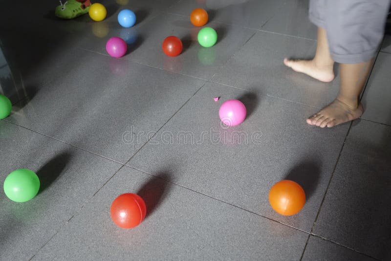 Kids Playing with the Plastic Colourful Ball on the Floor Stock Photo ...