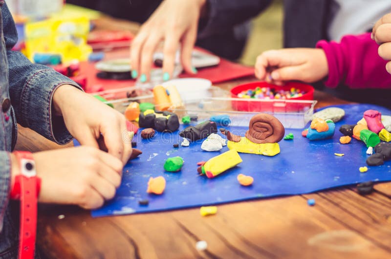 Playing with play dough stock photo. Image of colorful - 118273196