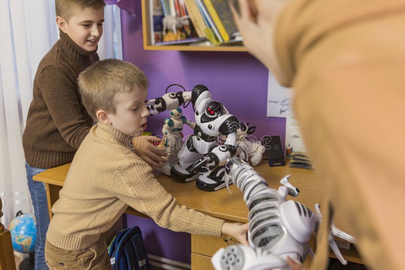 Kids playing with robots stock image. Image of childhood - 241096243