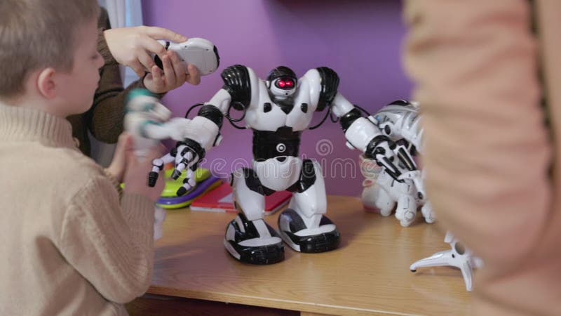 Kids playing with robots stock footage. Video of machine - 243178468