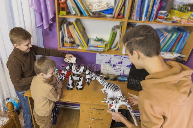 Kids playing with robots stock image. Image of caucasian - 242027267