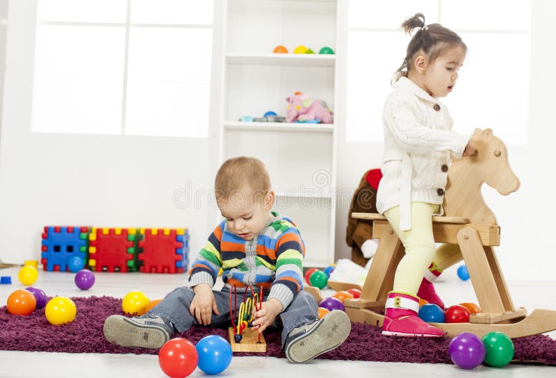 Kids playing in the room stock photo. Image of beautiful - 28144664